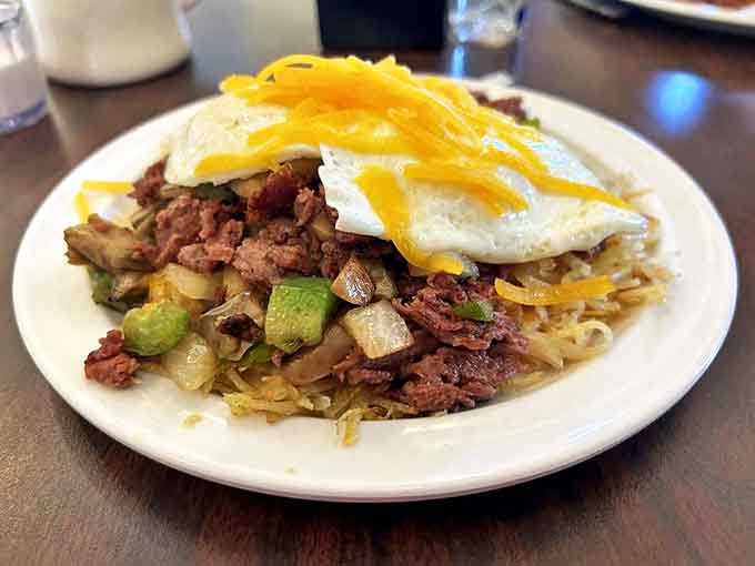 The Stack of Hash towers with corned beef, potatoes, eggs, and melted cheese, a breakfast skyscraper built on foundations of flavor.