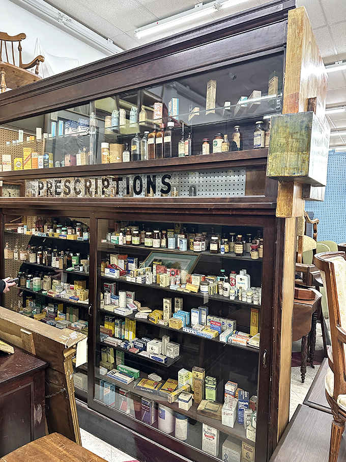 An antique pharmacy cabinet stands as a monument to medicine's past &ndash; those little bottles once promised everything from headache relief to "female hysteria" cures.
