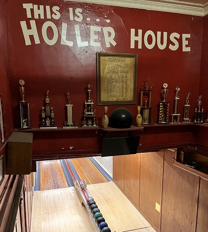 "THIS IS... HOLLER HOUSE" proclaims the wall above these historic lanes, where bowling tradition remains gloriously untouched by modern technology.