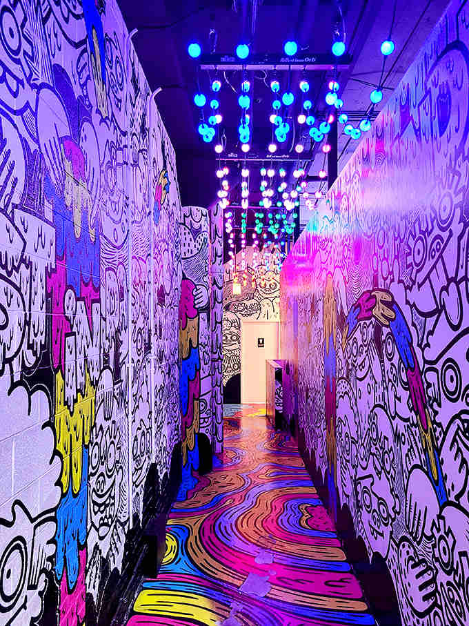 This psychedelic hallway looks like what would happen if a cartoon artist designed a nightclub &ndash; vibrant, surreal, and utterly captivating.