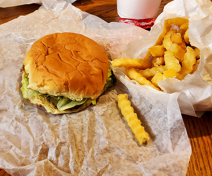 The Wally Burger sits proudly beside golden waffle fries – a duo that's been making Illinois mouths happy for generations.