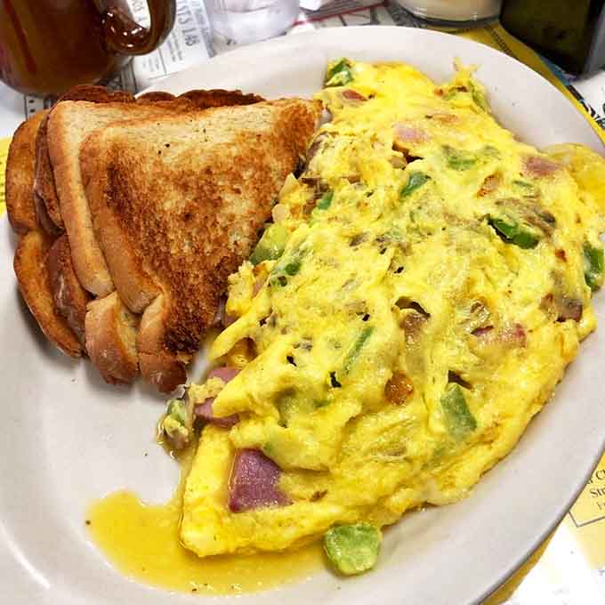 This Western omelet would make cowboys weep with joy &ndash; peppers and ham nestled in fluffy eggs like a savory sunrise.