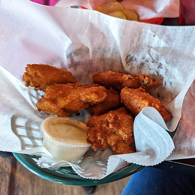 Crispy chicken strips that could make Colonel Sanders weep with jealousy, served with dipping sauce for maximum satisfaction.