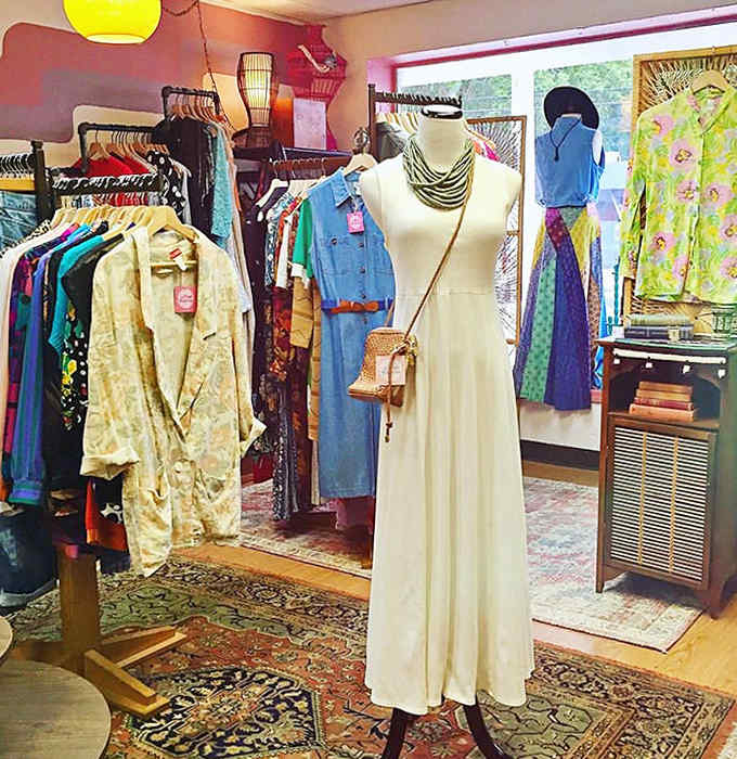 Vintage dresses await their second act on this elegant stage, where mannequins model the fashionable ghosts of decades past.