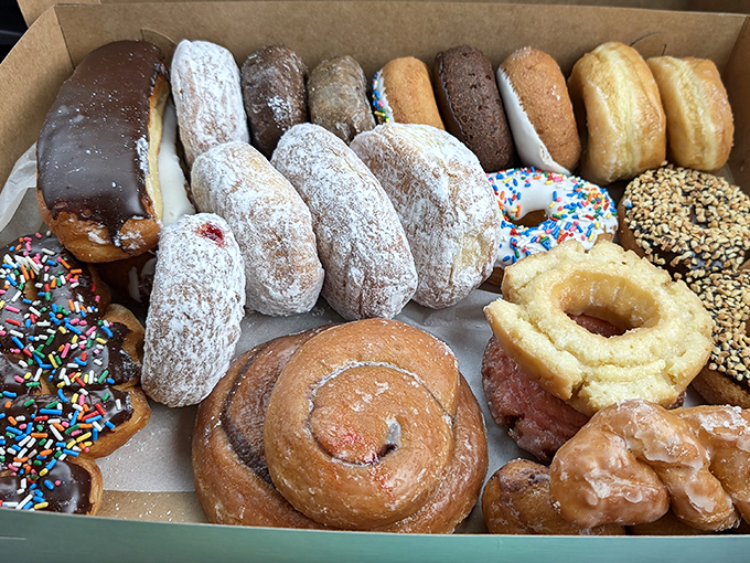 A box of mixed dozen glory – the ultimate treasure chest that turns any bearer into the office hero or family favorite upon arrival.
