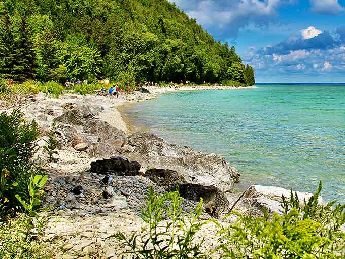Crystal clear waters meet rocky shores along Mackinac's coastline, offering views that no filter could improve and water too chilly for most swimmers.