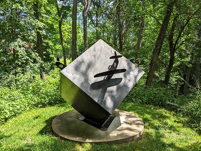 The black cuboid sculpture stands like a mysterious monolith, making you wonder if it's about to start communicating with passing spacecraft.