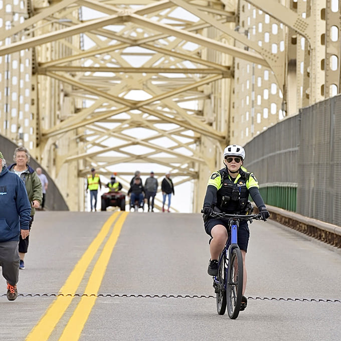 The International Bridge connects Michigan to Ontario, offering pedestrians and cyclists a unique opportunity to casually stroll between countries while enjoying river views.