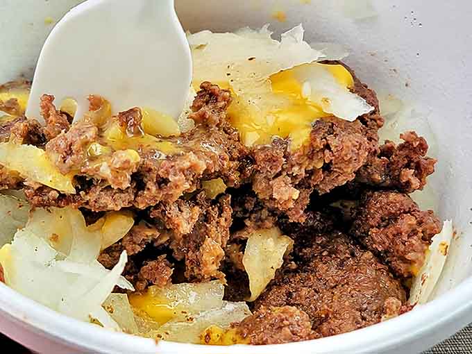 A bowl of beefy goodness topped with melted cheese and onions &ndash; comfort food that speaks directly to the soul.