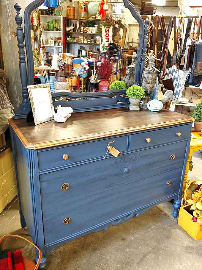 This elegant dresser with mirror has reflected a century of faces. Imagine the outfits it's witnessed, the hairstyles it's approved, the secrets it's kept.