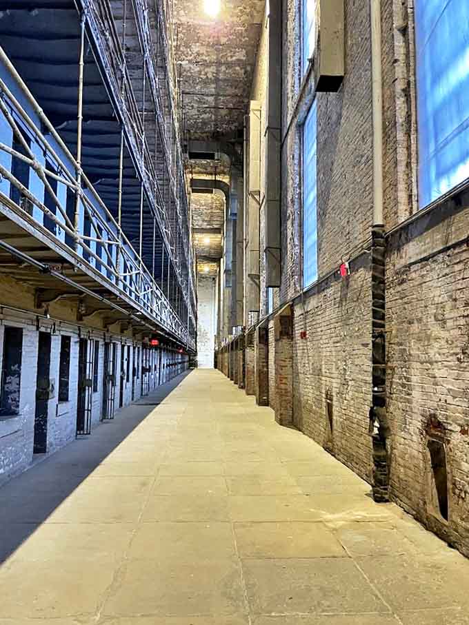 Perspective in punishment: The seemingly endless corridor of cells creates an optical illusion that makes freedom feel like a mathematical impossibility.
