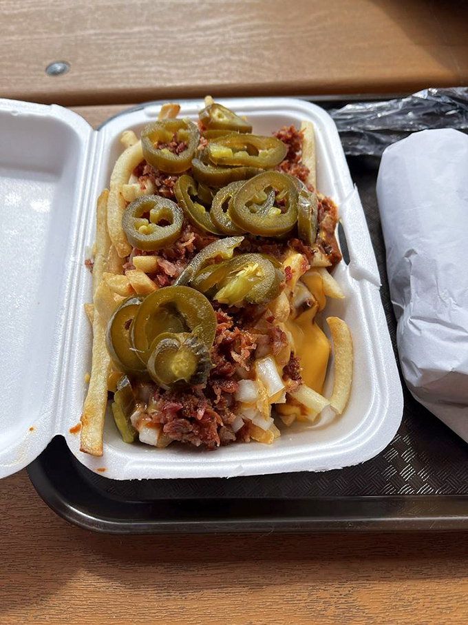 This loaded fries come topped with chili, cheese, and jalapeños – a messy masterpiece that's worth every napkin you'll need afterward.