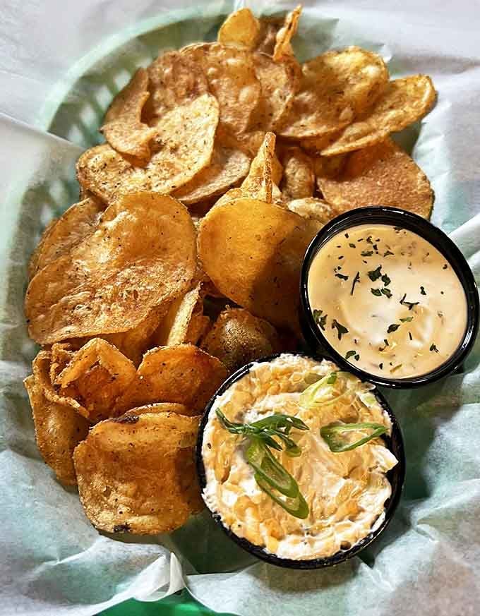 House-made chips that shatter with each bite, served alongside dips that make you wonder why you'd ever settle for the bagged variety again.