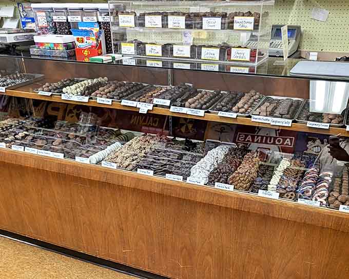 Handcrafted chocolates glisten behind glass, each one a testament to the artistry that goes into creating these bite-sized masterpieces.