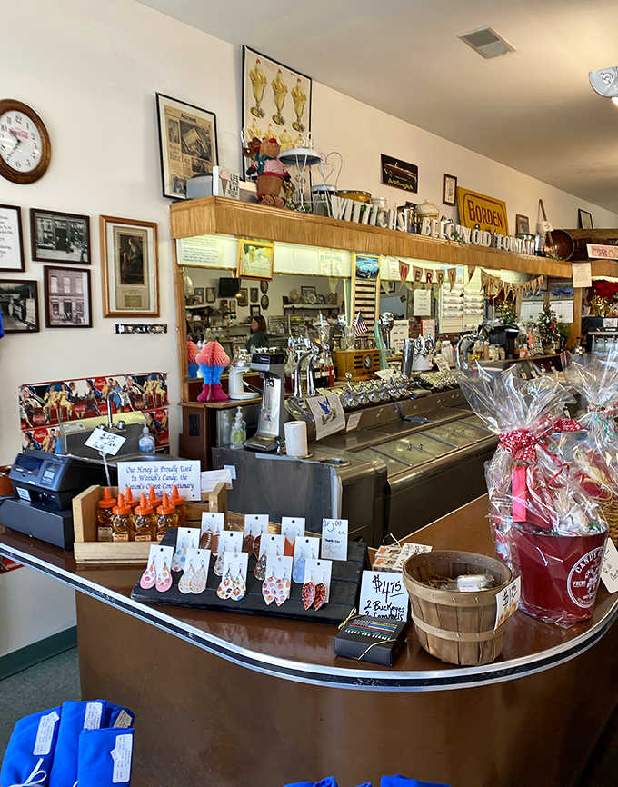 The vintage counter proudly displays "WITTICH'S BEECH-WOLD FOUNTAIN" above &ndash; a sweet command center where soda jerks have crafted happiness for generations.