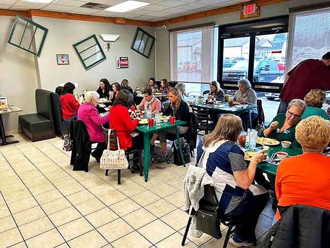 The bustling dining room where breakfast dreams come true. Notice how everyone's leaning in &ndash; that's the universal body language for "this food is amazing."
