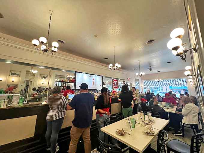 The counter buzzes with anticipation as patrons line up for their sweet fix, a timeless ritual that hasn't changed in decades.