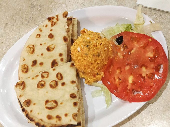 Pita perfection with tirokafteri (spicy feta spread) – proof that simplicity and flavor can create culinary magic.
