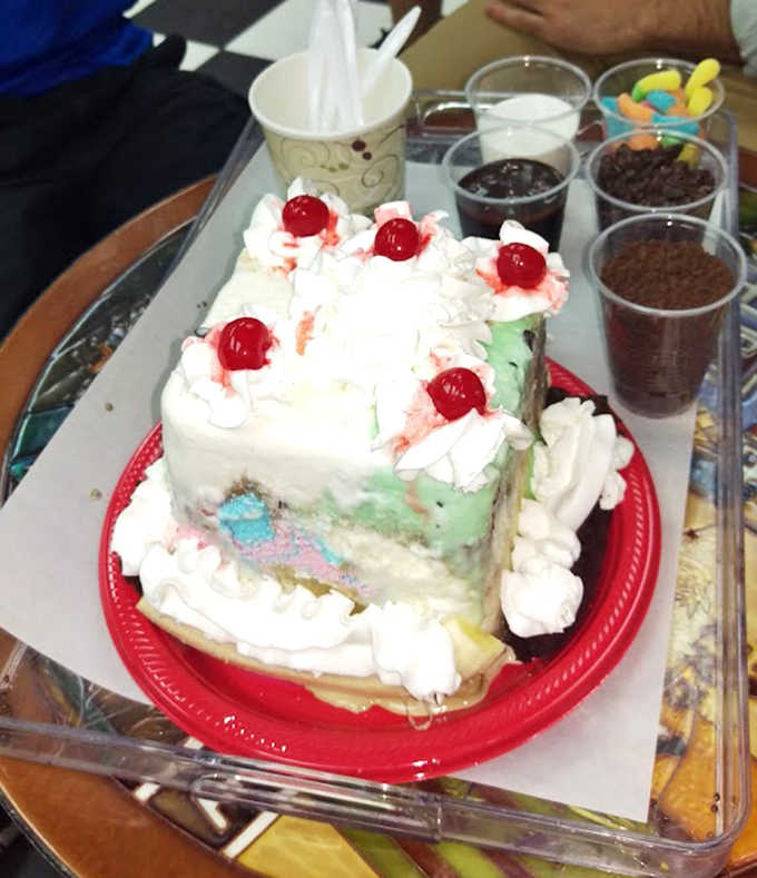 This isn't just cake &ndash; it's a celebration stacked in layers of ice cream, topped with whipped cream and cherries that say "today is special."