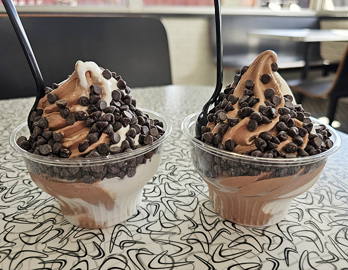 Chocolate chips cascading over soft serve like an avalanche of happiness. The contrast between cold ice cream and warm fudge creates edible poetry.