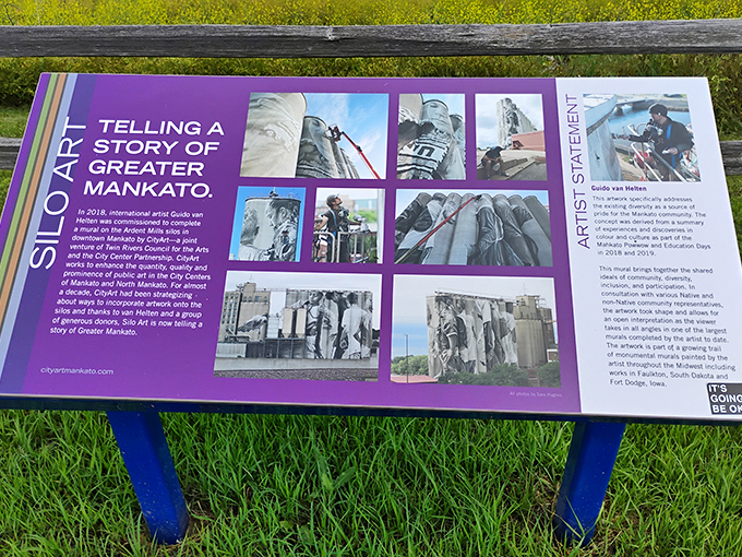 This informational sign explains the artistic journey behind the silo project, detailing how Australian artist Guido van Helten captured Mankato's spirit.