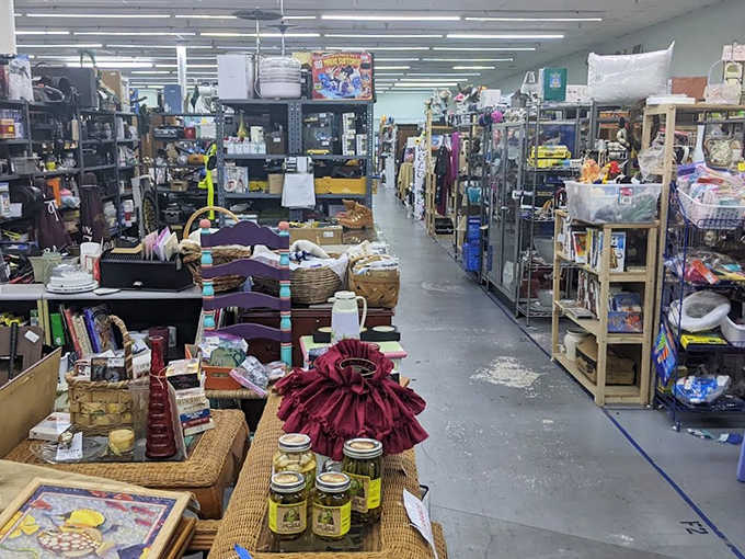 The thrift store aesthetic shines here, with glass cases protecting delicate treasures while baskets and shelves overflow with items begging to be discovered and loved.