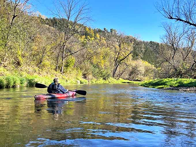 Kayaking the gentle Root River offers a perspective you can't get on land &ndash; peaceful waters reflecting limestone bluffs and lush greenery.