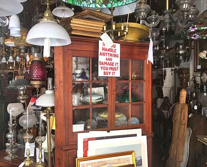 The sign warns "If you handle anything and damage it you must buy it" &ndash; fair enough when surrounded by fragile connections to America's past.