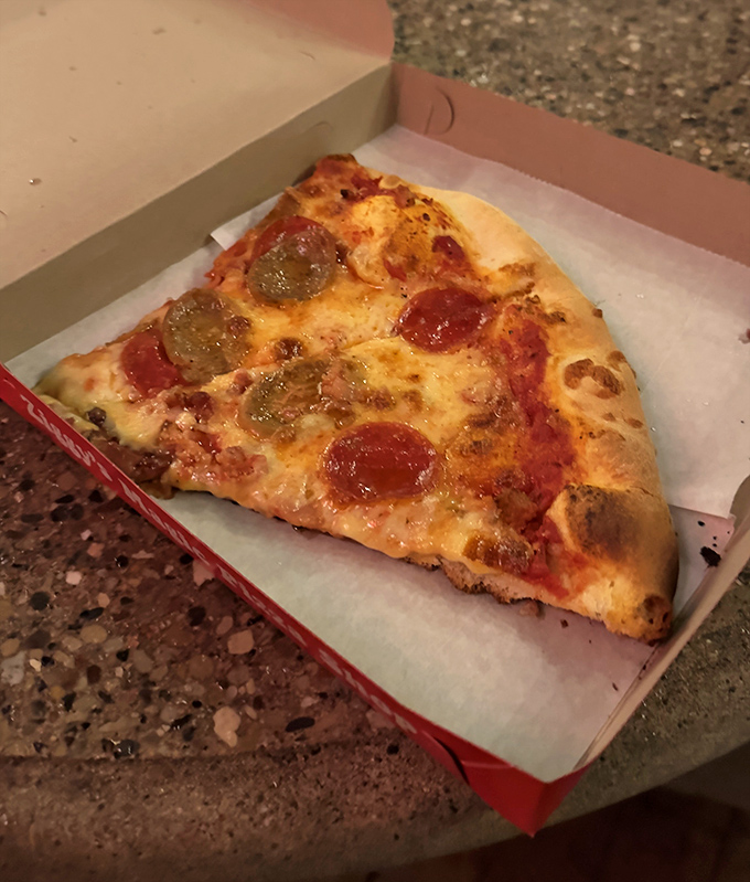 Sometimes simplicity wins &ndash; this classic pepperoni and sausage slice demonstrates why pizza fundamentals never go out of style.