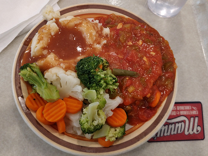 Comfort on a plate &ndash; this meatloaf with tomato sauce and fresh vegetables doesn't need fancy plating to make your stomach smile.
