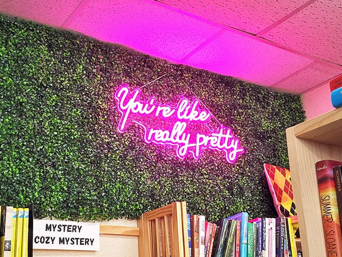 The neon glow against greenery creates the perfect Instagram moment &ndash; because even bookworms appreciate good lighting.