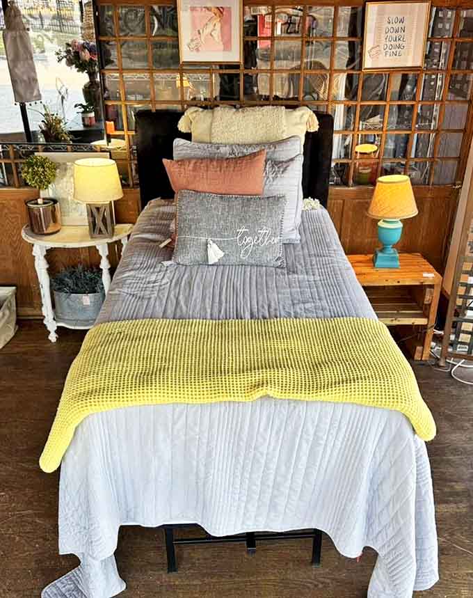 Layered textiles and thoughtful design transform an ordinary bed display into a master class in affordable bedroom makeovers.