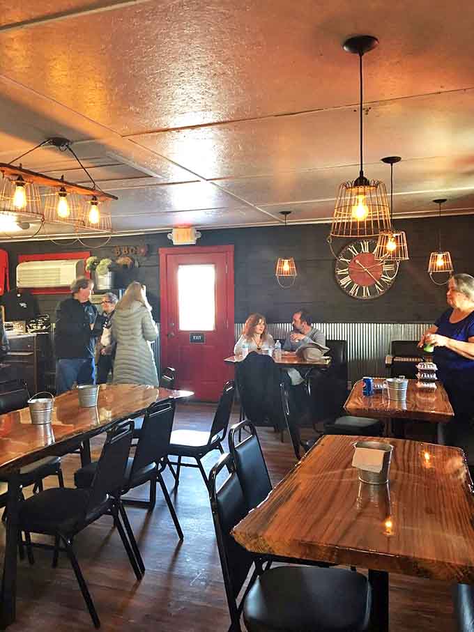 The dining room buzzes with the happy sounds of people experiencing food joy. Notice the wire basket lights &ndash; rustic chic done right.