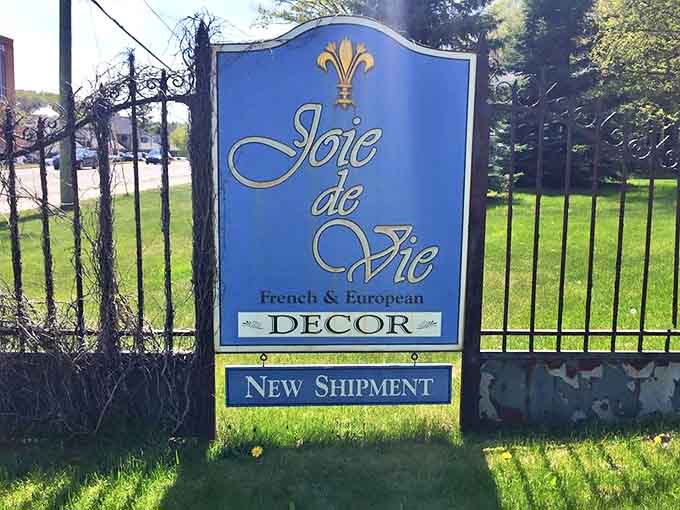 The signature blue and gold signage announces your arrival at a slice of Europe—no passport required, just bring your imagination and perhaps a credit card.