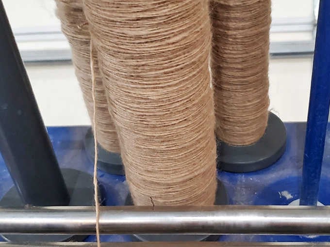 These spools of alpaca yarn represent hours of careful work, turning soft fleece into fiber that knitters and crafters dream about.