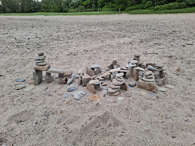 Beach artists leave their temporary mark &ndash; carefully balanced stone sculptures emerge from the shoreline like miniature ancient monuments.