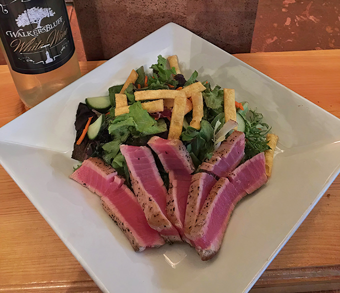 Perfectly seared tuna meets garden-fresh greens &ndash; a plate that proves Walker's Bluff's culinary ambitions match its winemaking prowess.