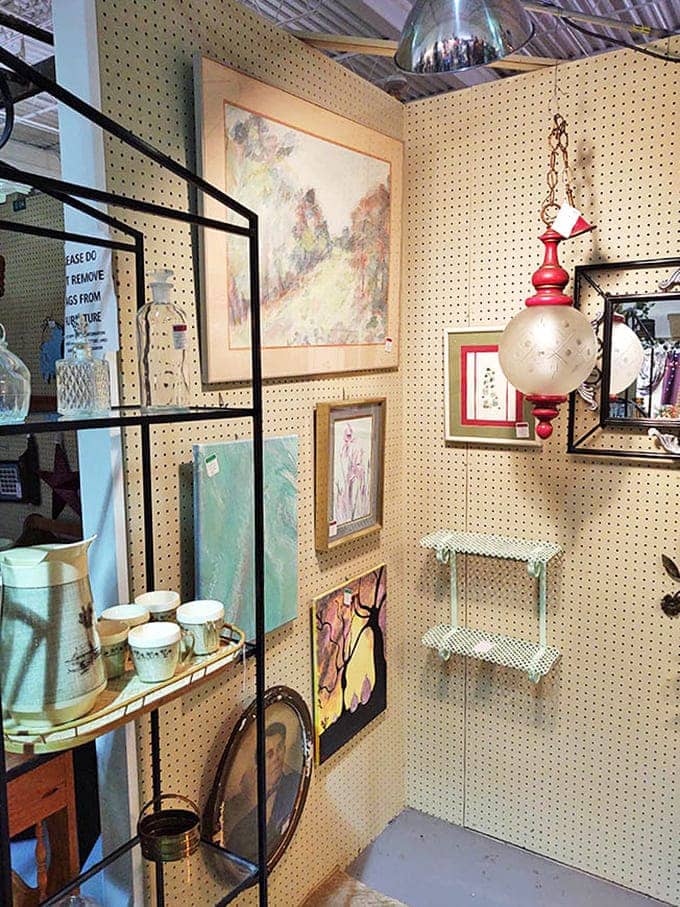 A collector's paradise where vintage glassware, artwork, and home decor create a visual feast that would make any interior designer's heart skip a beat.