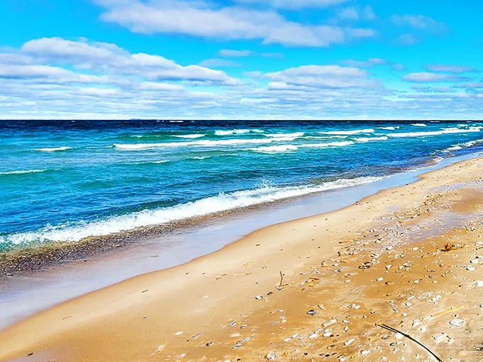 The golden hour at Christmas Cove paints the landscape in warm hues, highlighting the natural beauty of this hidden gem.