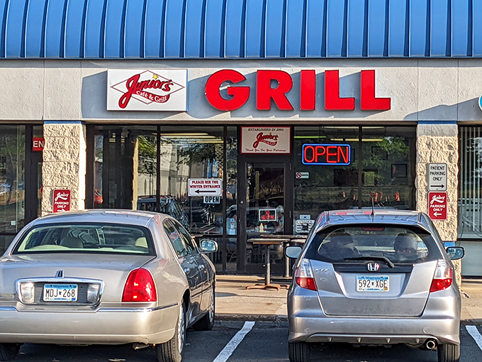 Junior's Cafe & Grill welcomes diners with its distinctive blue awning and bright red signage, a neighborhood favorite in Eagan.