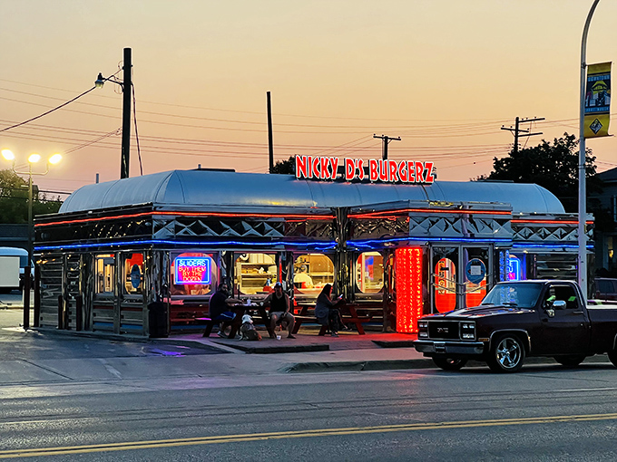 Nicky D's chrome diner car design gleams under evening lights, a shining example of authentic 1950s roadside architecture.