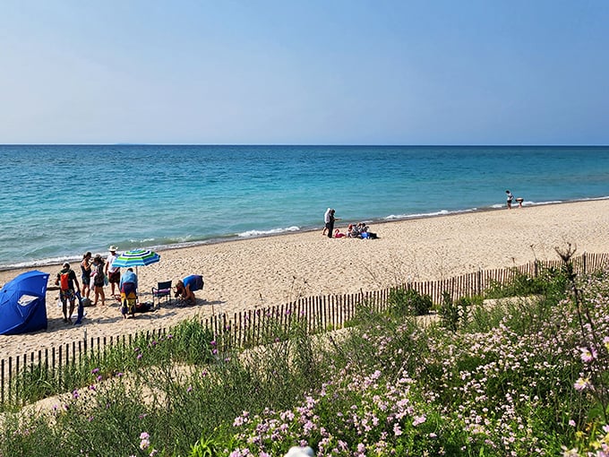 Christmas Cove Beach welcomes visitors with its small-town charm and crystal waters perfect for hunting Petoskey stones.