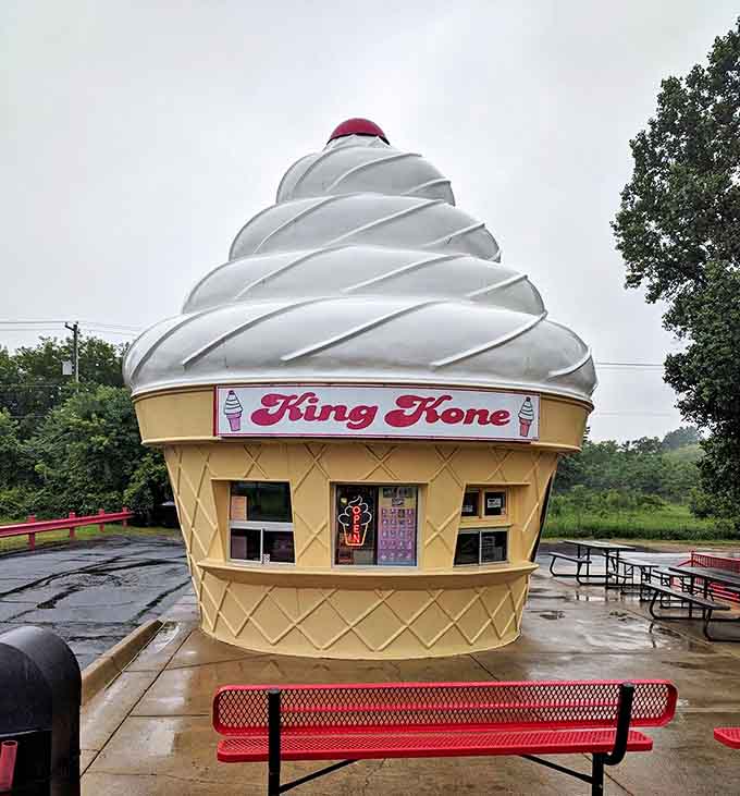 Even on cloudy days, King Kone's massive ice cream cone structure stands tall as a monument to frozen dessert devotion. The waffle-patterned base adds authentic detail to this sweet landmark.