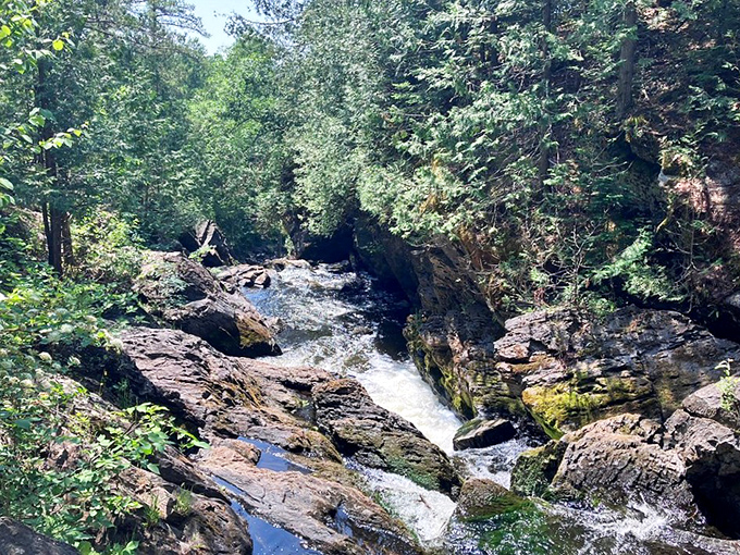 The remote setting of Long Slide Falls rewards hikers with pristine wilderness views and the soothing sound of water meeting ancient stone.