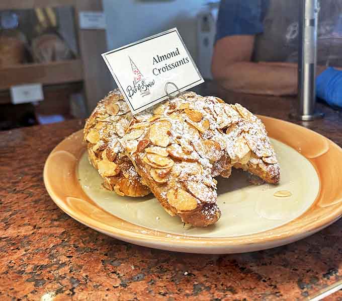 Almond Croissant: Flaky layers of buttery pastry wearing a coat of sliced almonds &ndash; the kind of breakfast that makes Monday mornings bearable.