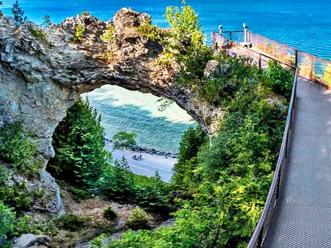Arch Rock frames the azure waters below like nature's own picture window, proving Mother Nature was into Instagram-worthy spots long before Instagram existed.