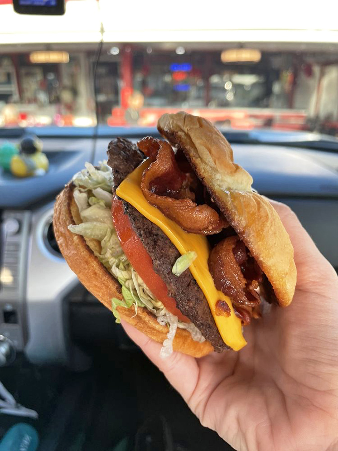 The bacon cheeseburger doesn't just have bacon; it has substantial strips that provide a smoky counterpoint to the perfectly seasoned beef.