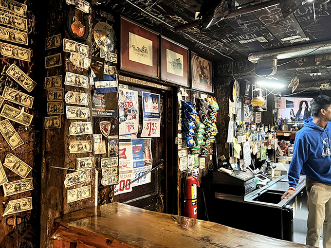 The bar's interior is a living museum where every signature, dollar bill, and memento tells a chapter of local history.
