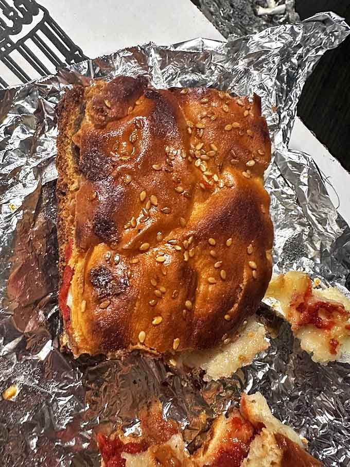 Sesame-seeded perfection: the meatball sub emerges from its foil cocoon, ready to satisfy the most demanding sandwich connoisseur.