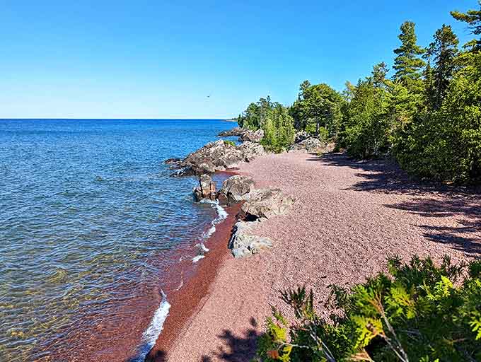 Beach: That perfect blend of rugged and serene &ndash; where Lake Superior's blue waters kiss a shoreline of rusty-red pebbles beneath towering pines.